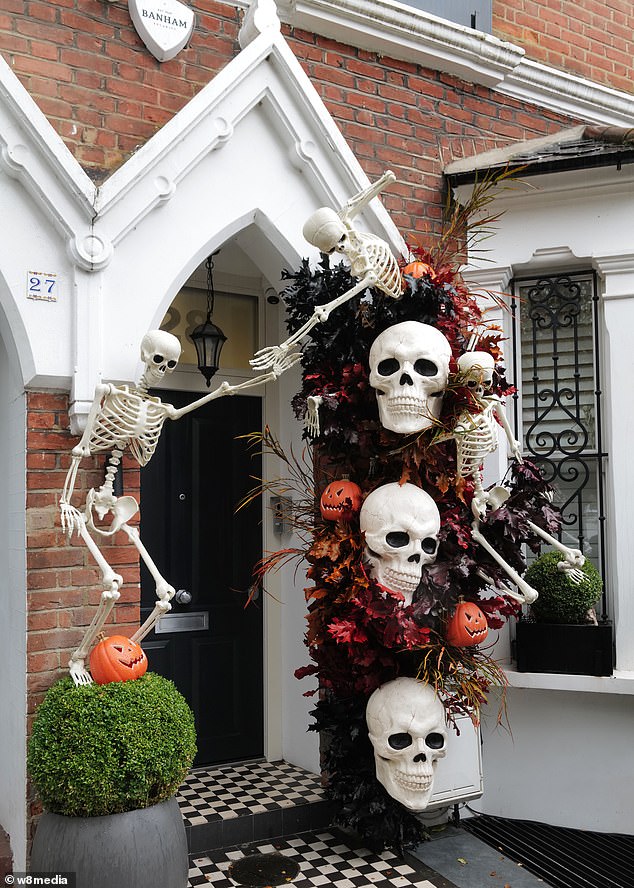 Halloween havoc: Skeletons, coffins and ghouls decorate some of London ...