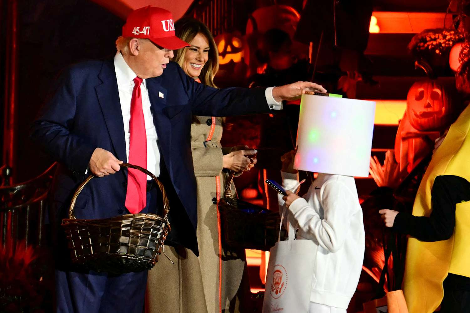Trump Places Candy on Trick-or-Treater's Head in Recreation of Viral ...