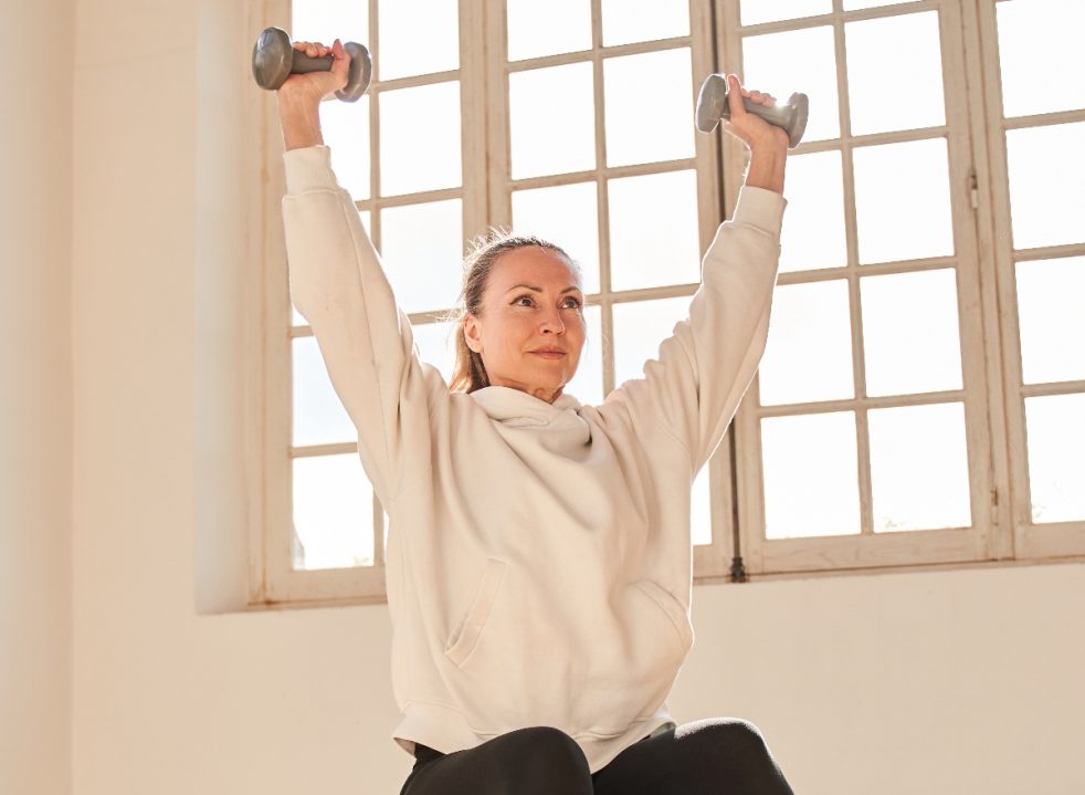 A fitness coach shares 5 chair exercises to rebuild arm strength after 55