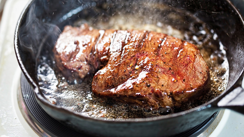 The Easy Trick To Prevent Your Steak From Taking On A Curved Bowl Shape