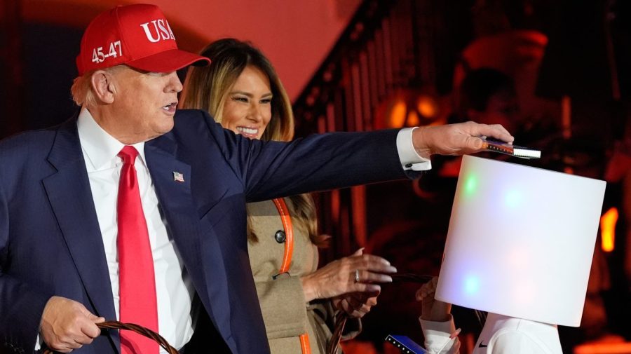 Trump puts candy on trick-or-treater’s head at Halloween event