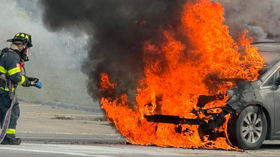 Ohio school van catches fire with people trapped inside
