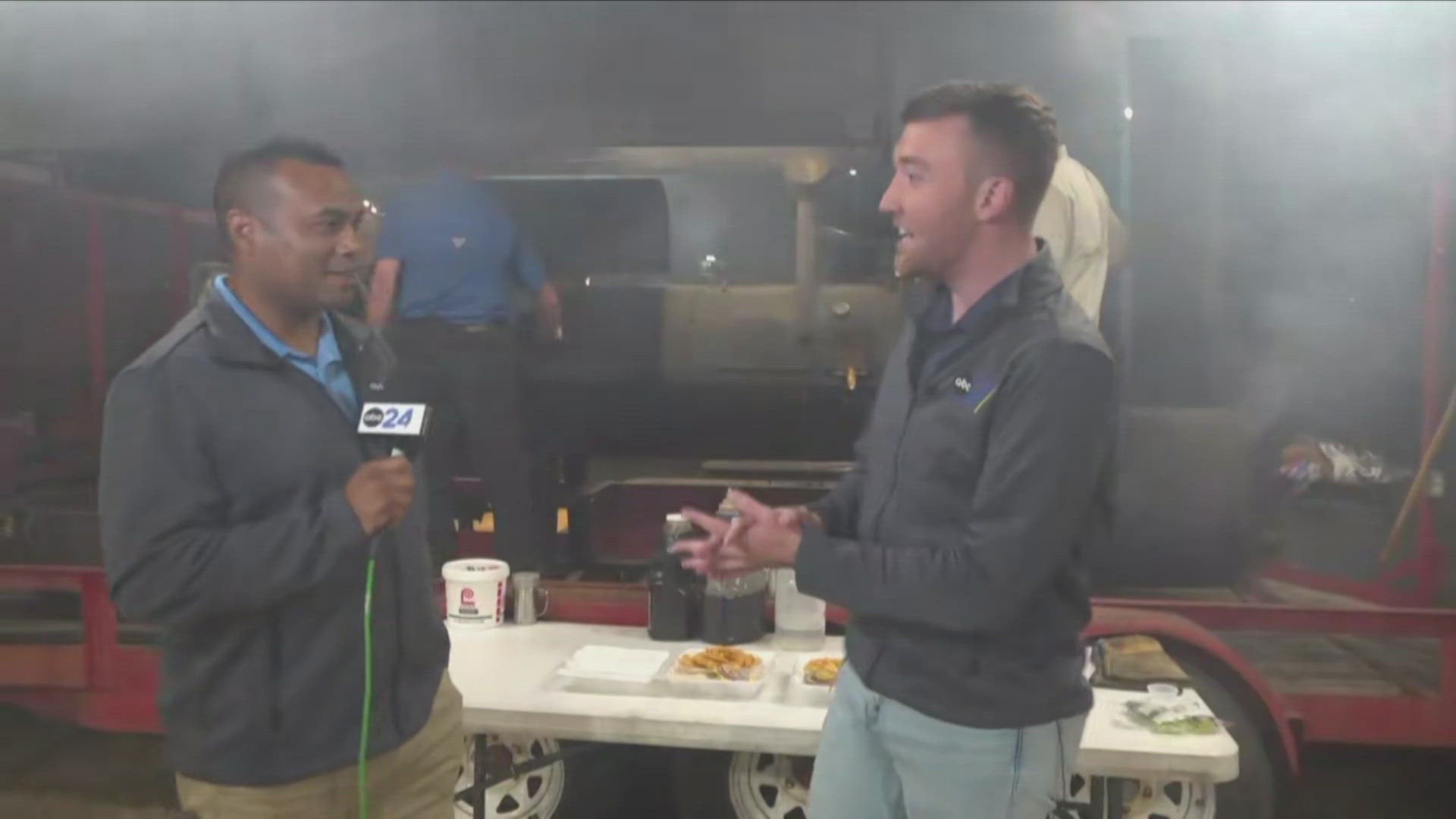 Chief Meteorologist Trevor Birchett introduces Ruben to the 'Trojan Burger'