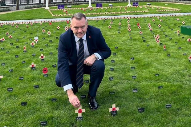 Cross planted in Garden of Remembrance by Torfaen MP