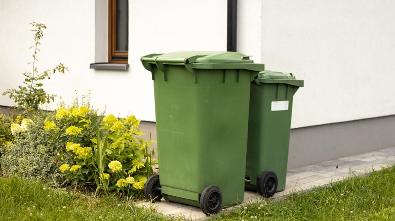 This Stylish DIY Makes Your Outdoor Trash Bins Way Less Of An Eyesore