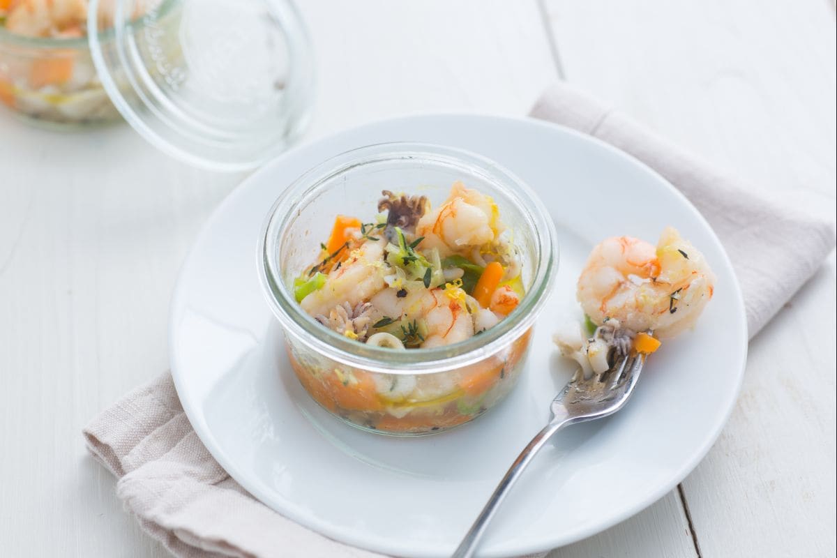 Seafood salad in jar cooking