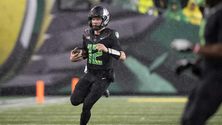 Live Score Updates as Oregon And Iowa Battle In Pouring Rain