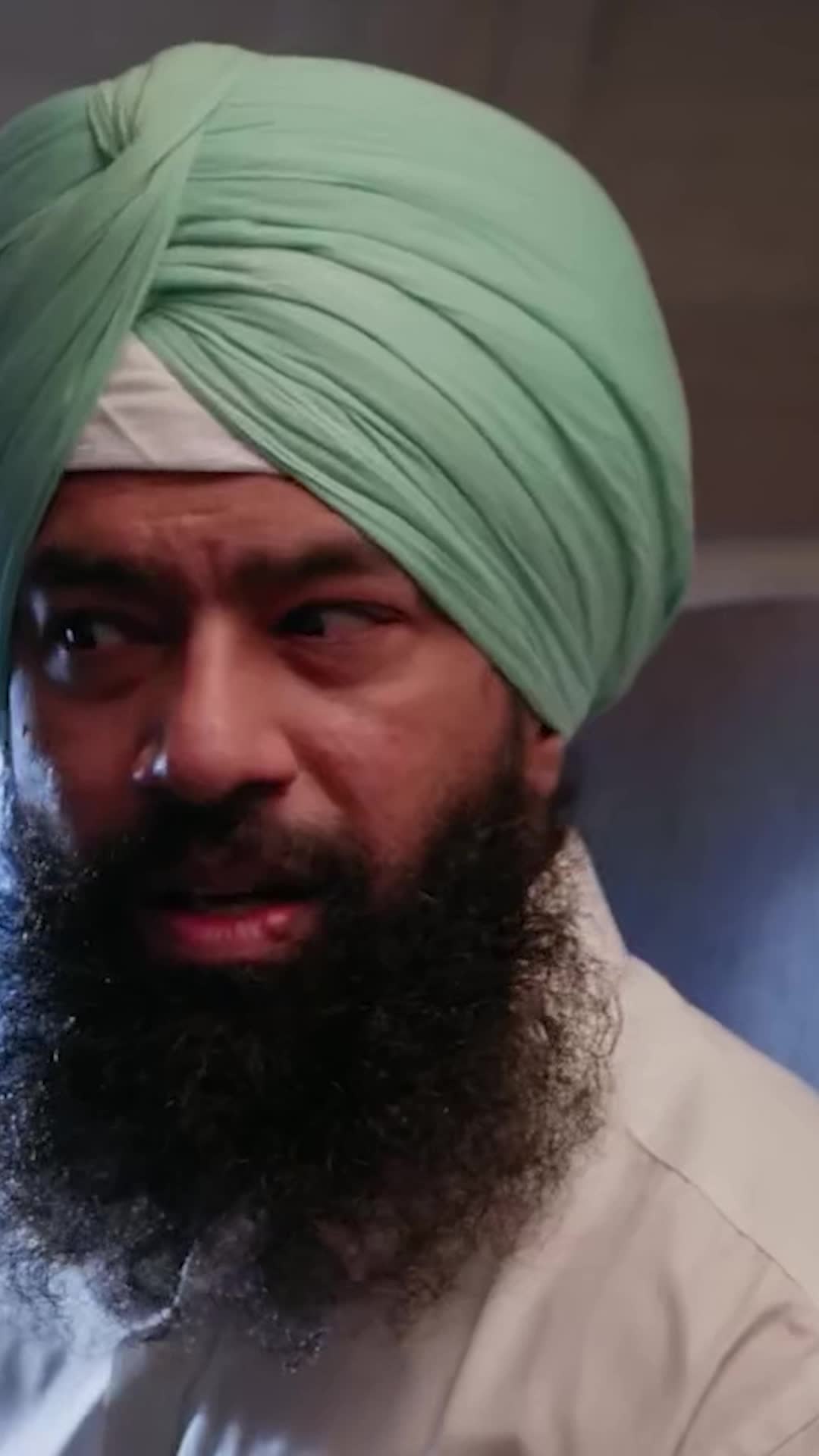 Turbaned passenger interrupted by a mean passenger