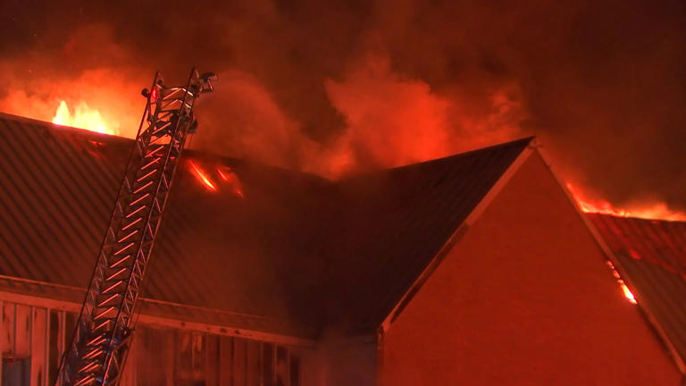 More than 200 displaced after huge fire destroys buildings at Mass ...