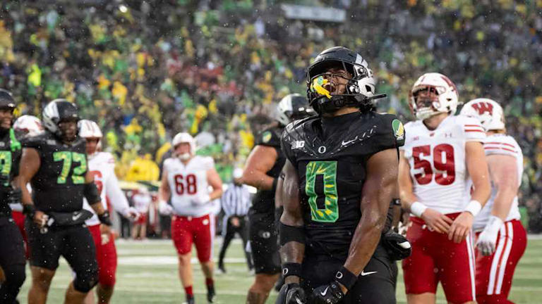 Live Score Updates as Oregon And Iowa Battle In Pouring Rain