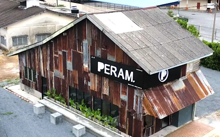 Rusty zinc facade serves as a magnet for this unique Kangar eatery