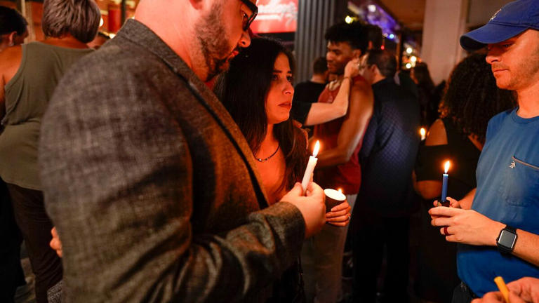 Scenes from vigil for victims killed in Ybor City crash