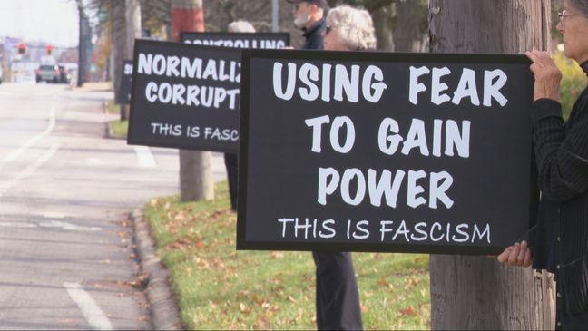 Activists gather in Anderson Township for 'Signs of Fascism Silent Protest'