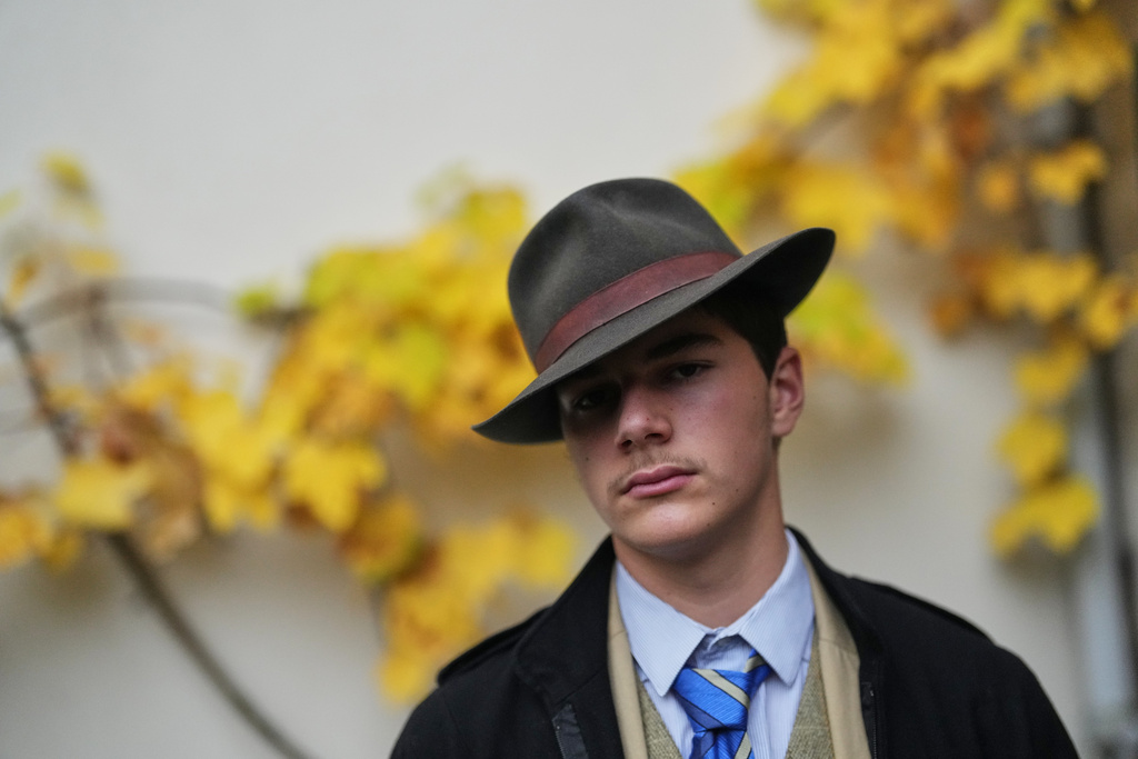 Fedora man unmasked: Meet the teen behind the Louvre mystery photo