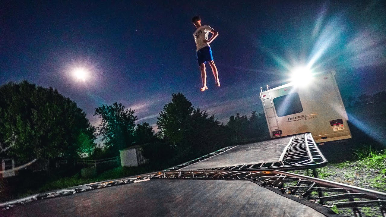 Trampoline tricks performed in the dark challenge
