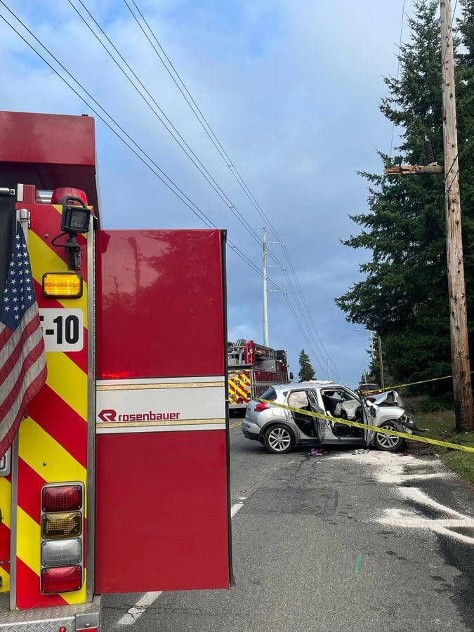 Tacoma firefighters rescue person trapped after car hits power pole