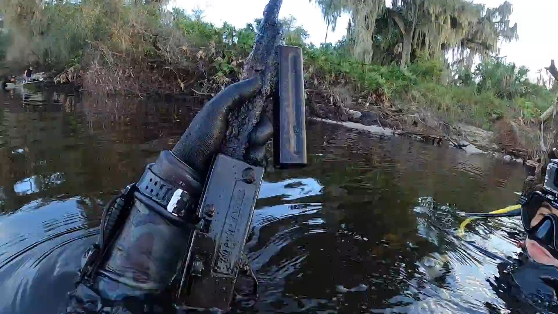The dive that went wrong: Alligators below, rifle beneath