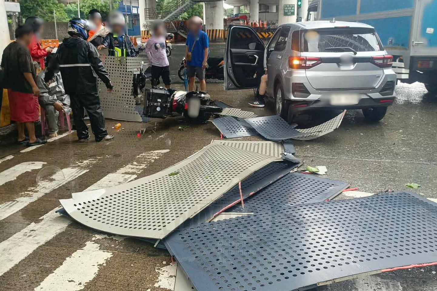 2 hurt after electronic billboard parts fell from QC building amid Uwan
