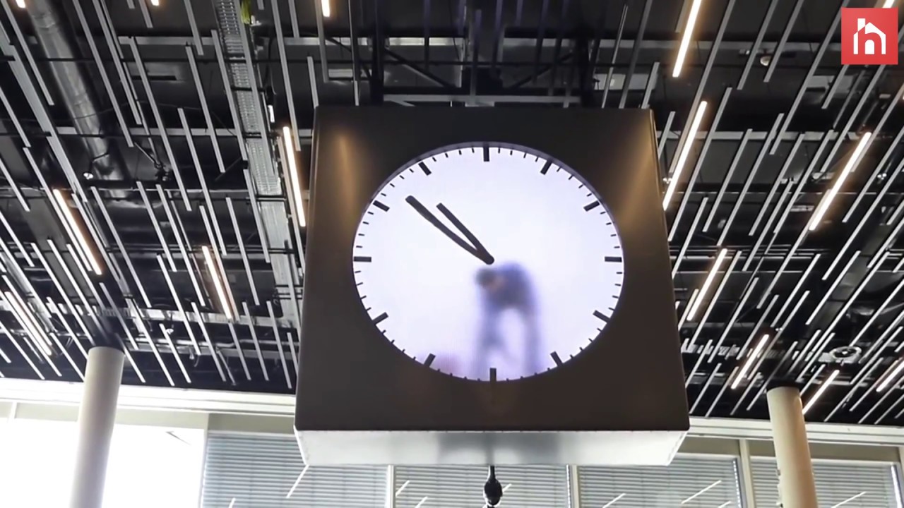 The clock that shows time by having its hands painted every minute by ...