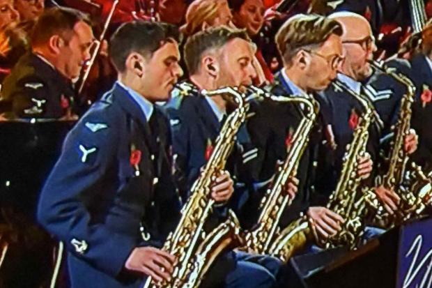 York saxophone player, Sam, shares stage with Sir Rod Stewart