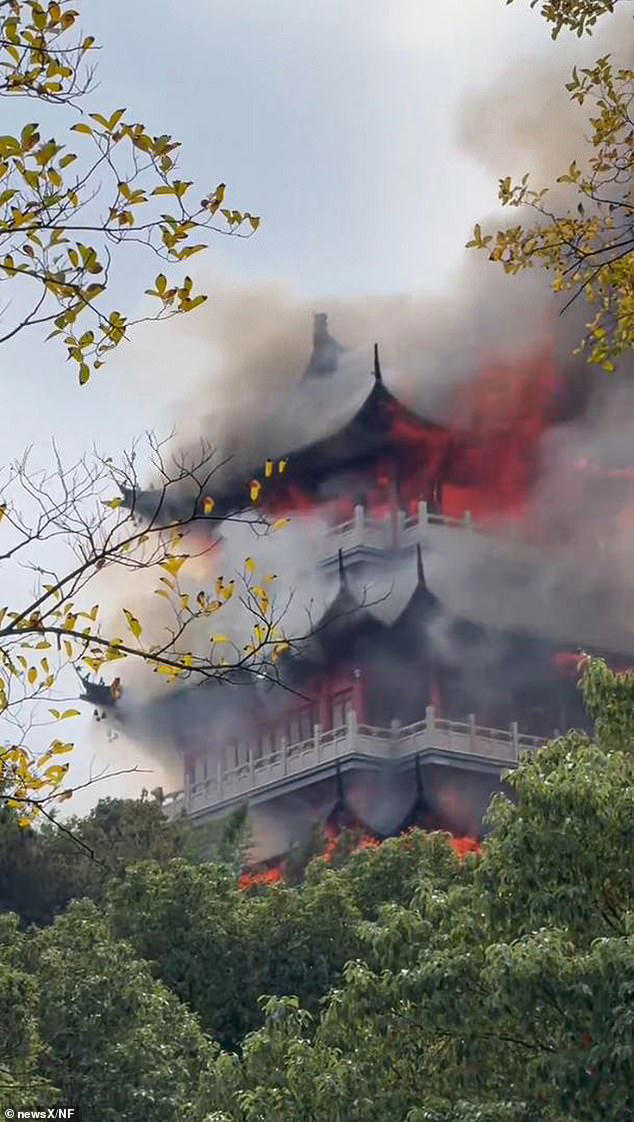 Tourist is blamed for burning down sacred Chinese temple with ...