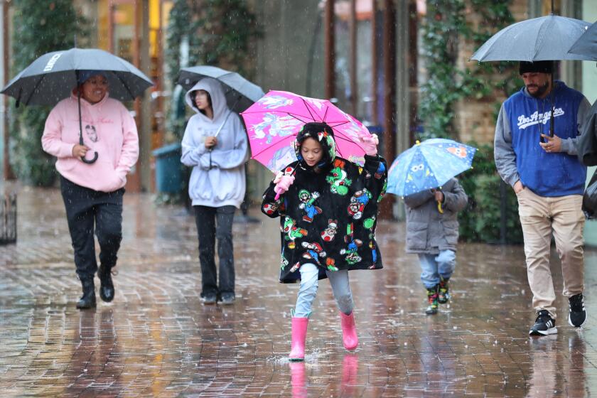 Major weekend storm drenches downtown L.A., with more rain on the way
