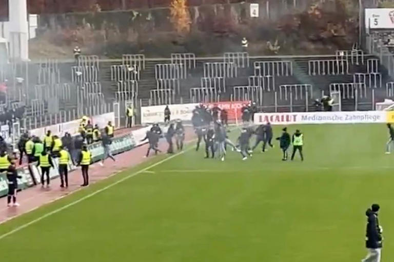 Football hooligans burn rival's flag and clash with 'pepper spray ...