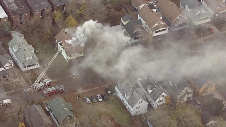 Firefighters working to put out fire at Cleveland home