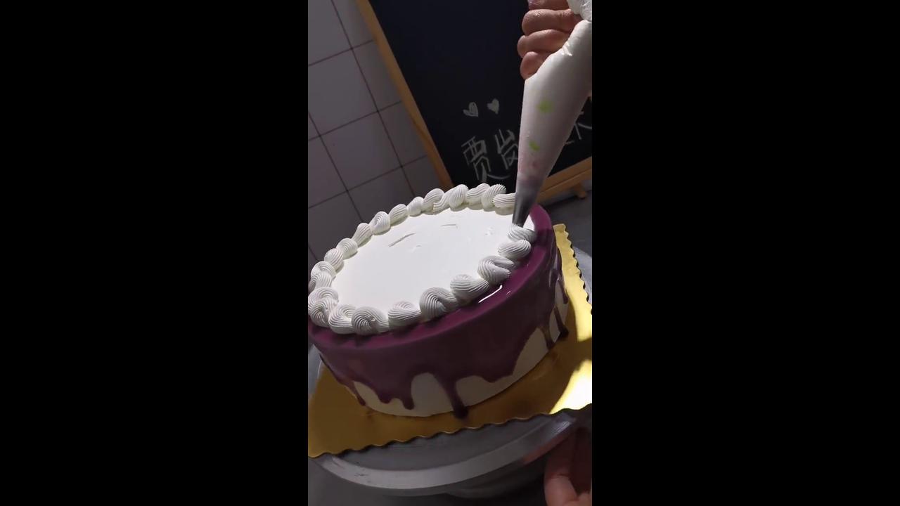 Making Purple Design With Fruity Toppings Icing Cake