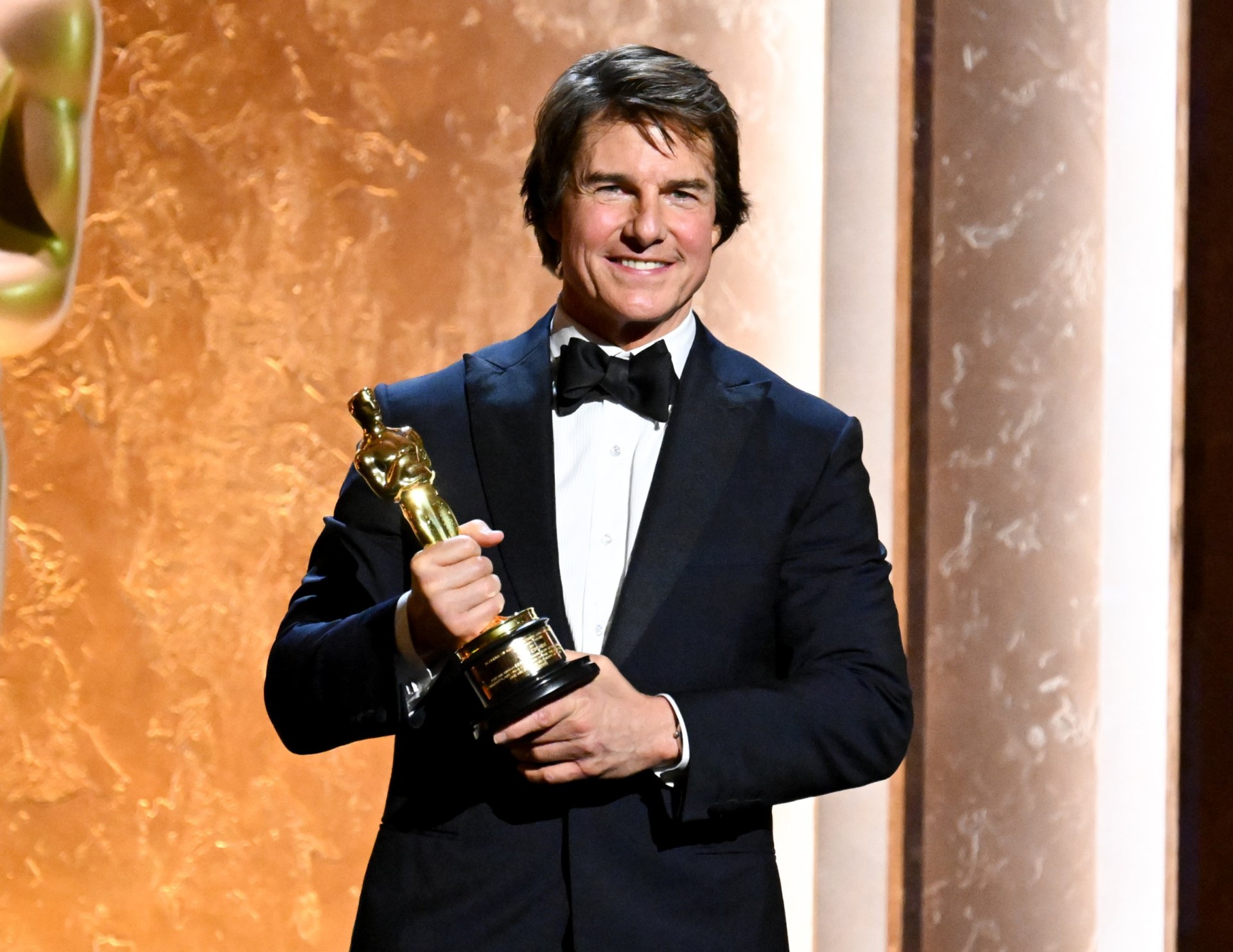 Tom Cruise celebrates his first Oscar win on the dance