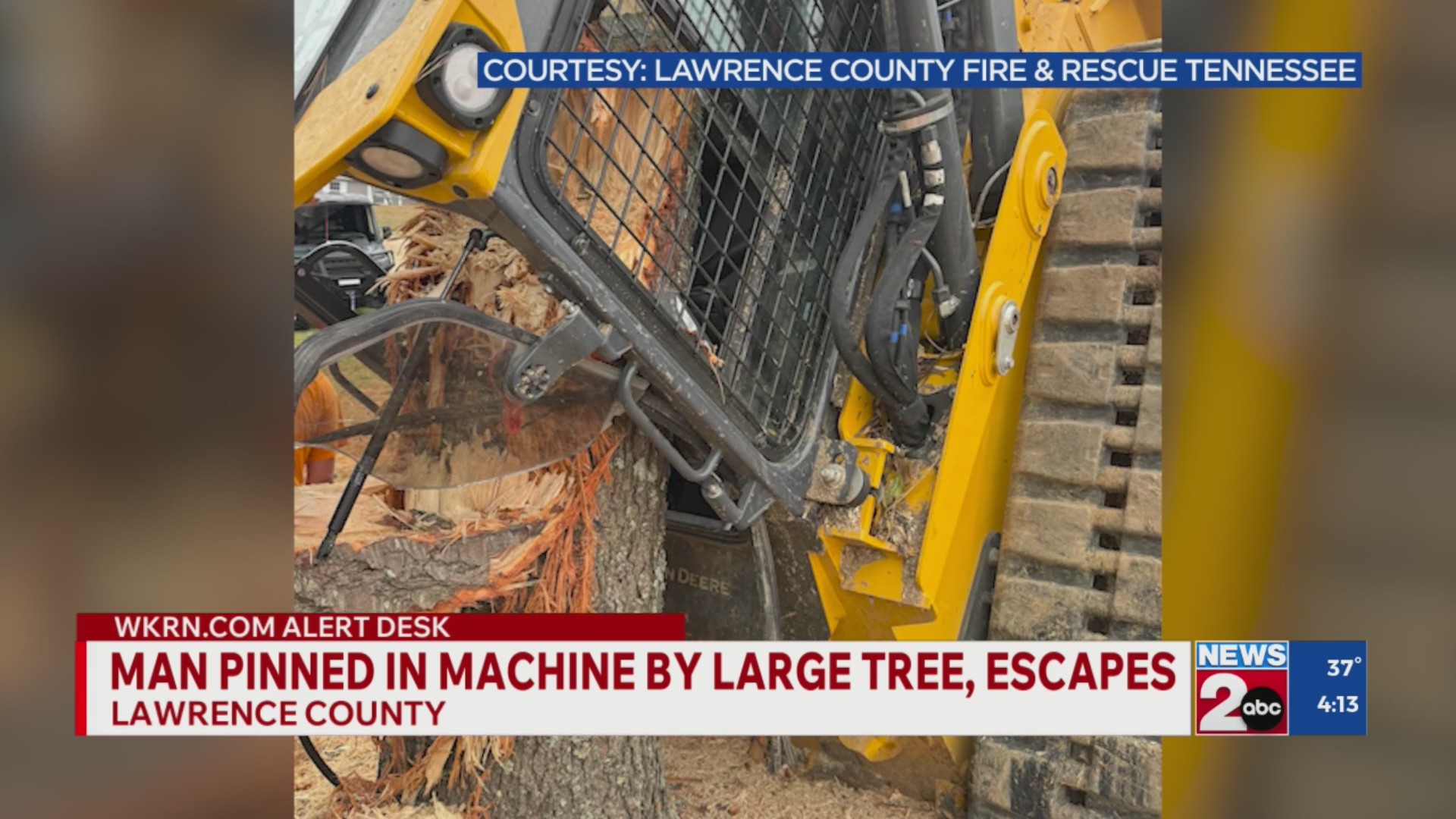 Man survives after tree pierces windshield of heavy equipment