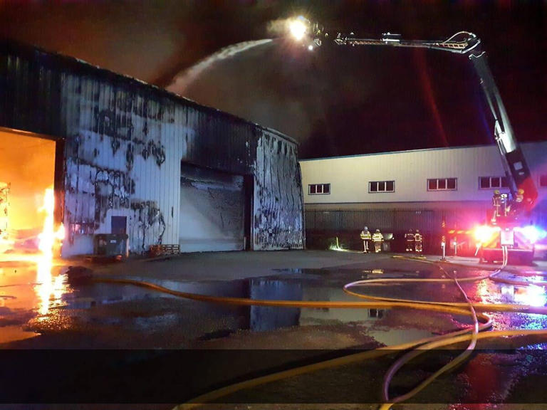 Major blaze levels Cork warehouse and trucks as explosions heard across ...