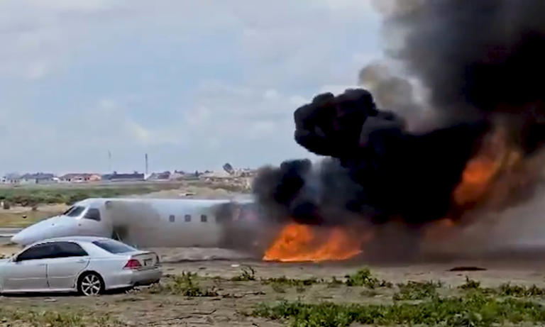 Moment minister's jet bursts into flame as it crashes after shooting ...