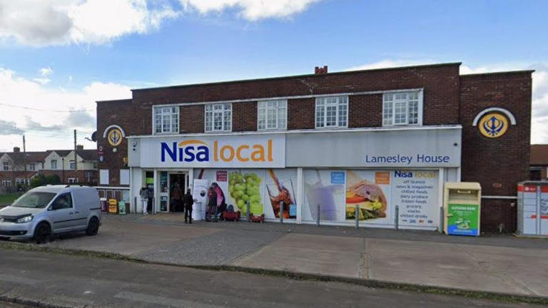 Men arrested over bomb hoax outside shop