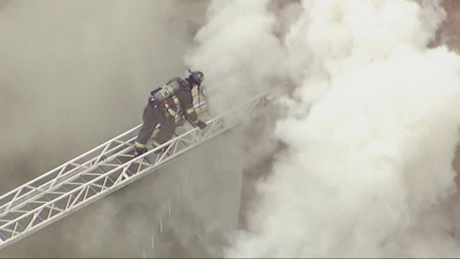 Firefighters working to put out fire at Cleveland home