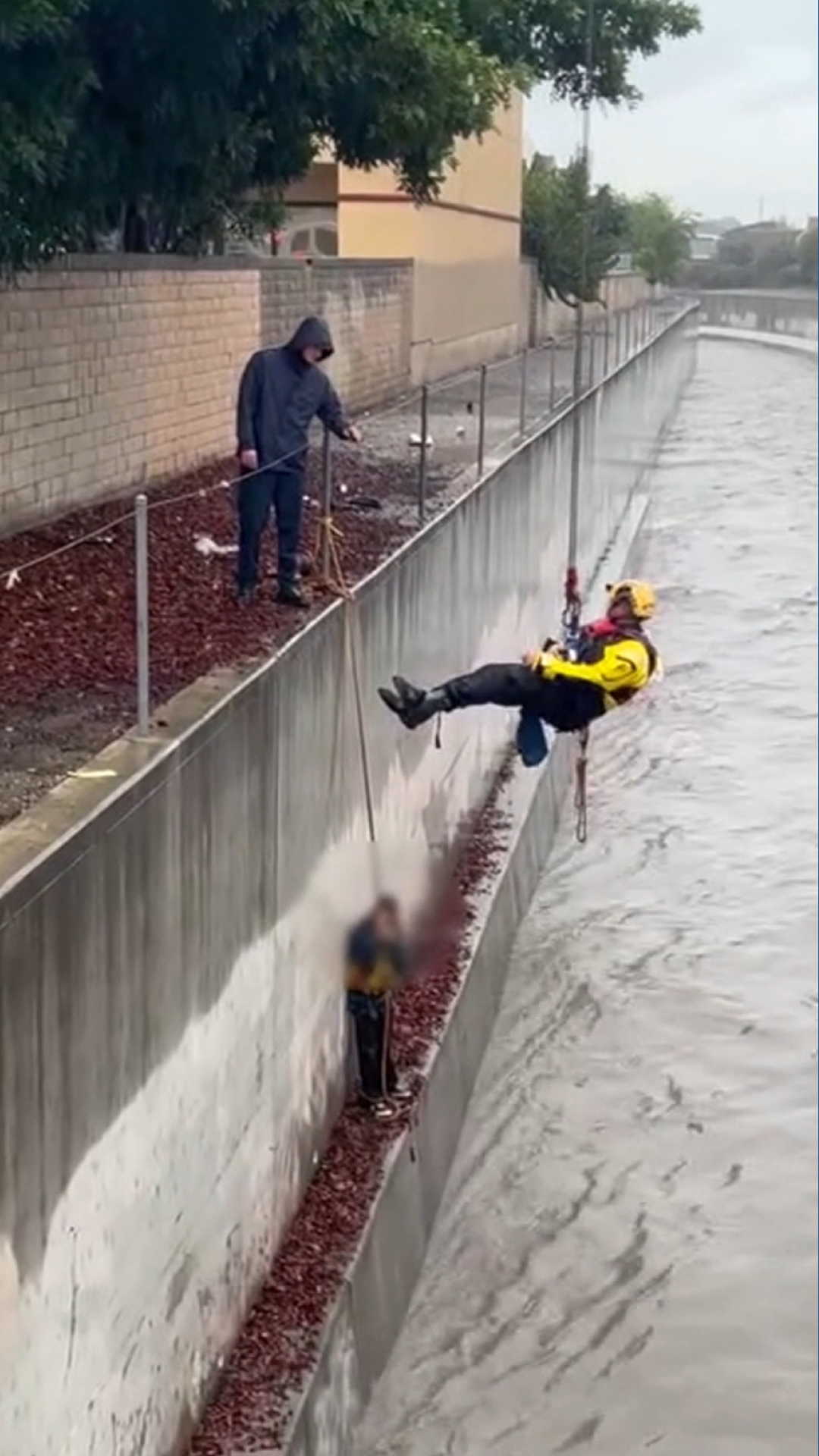 Firefighters in California rescue man trapped above rushing water ...