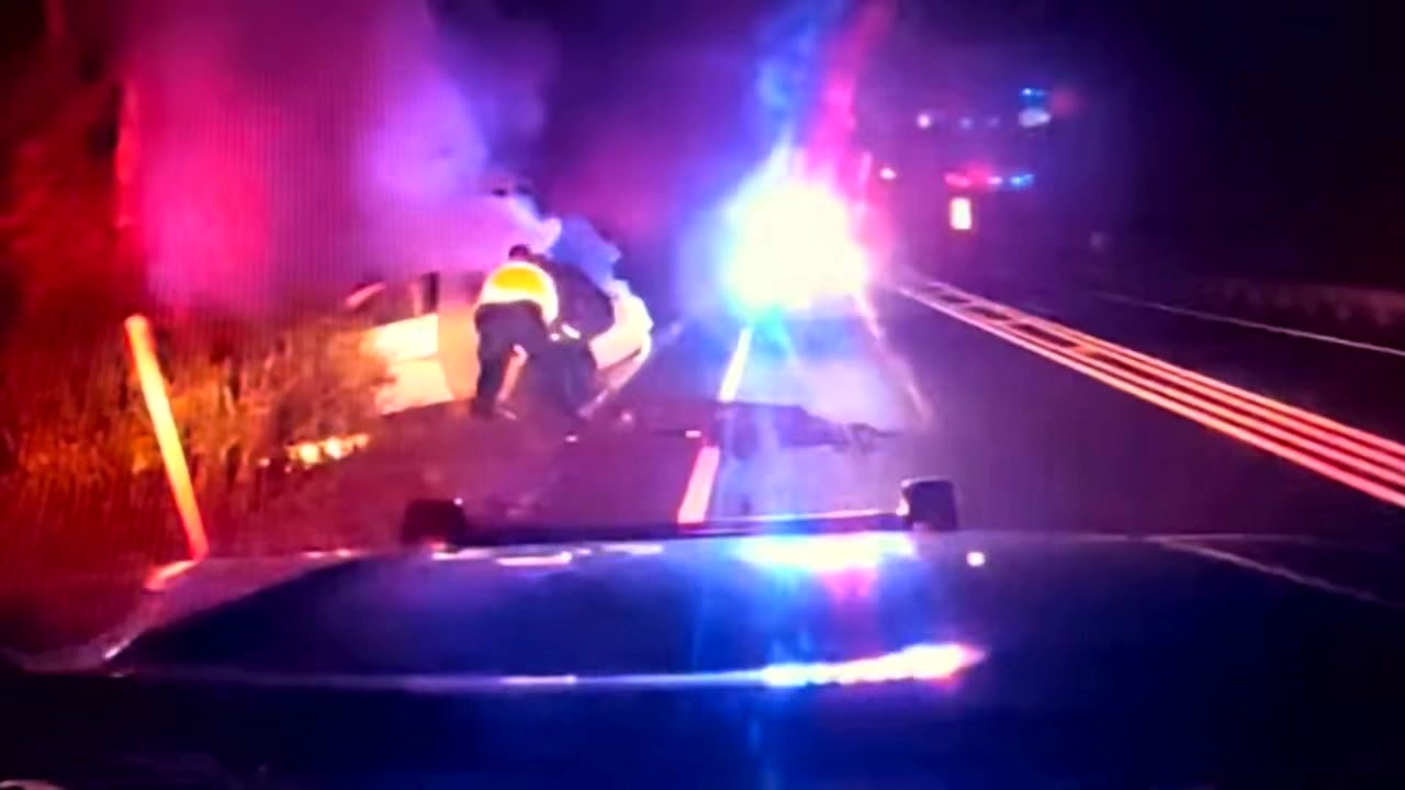 New Jersey officers rescue man trapped inside burning car