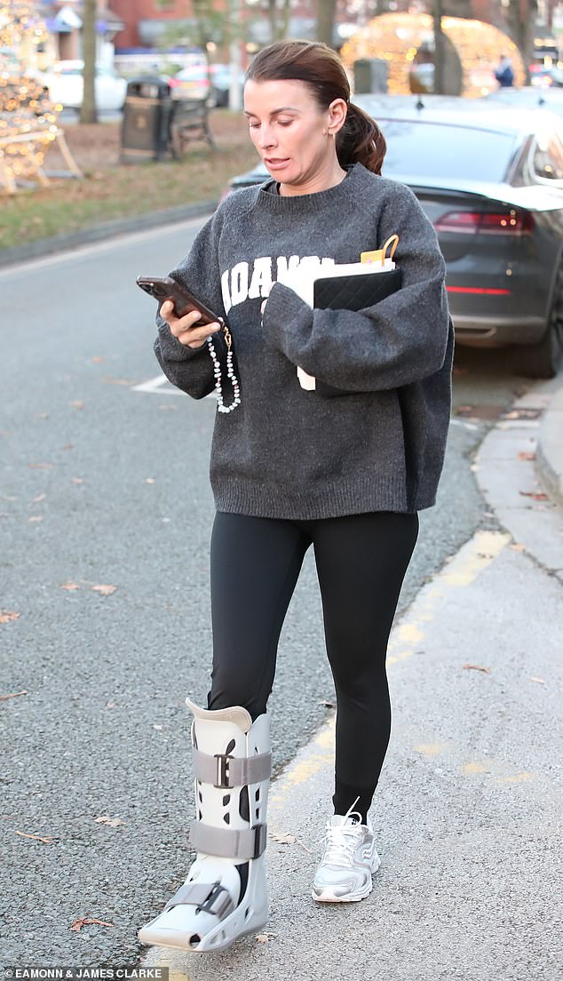 Coleen Rooney hobbles out of salon in an orthopedic boot after breaking ...