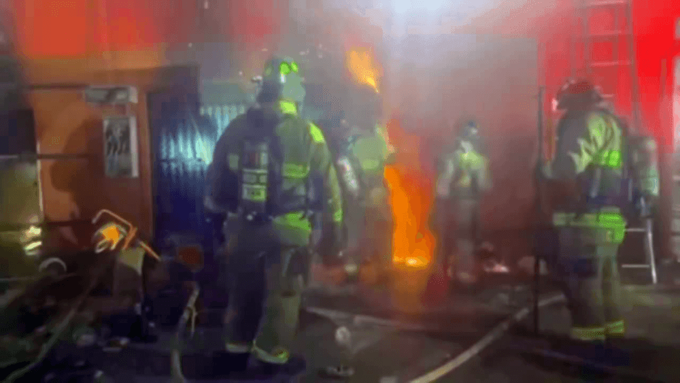 Firefighters rescue man from burning fortified building in Fresno