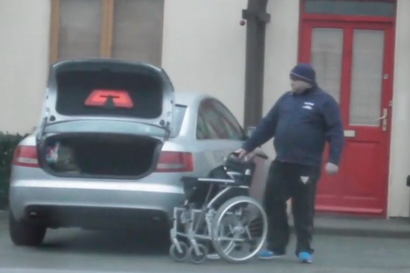 Watch moment 'injured' fraudster caught pushing wheelchair down street