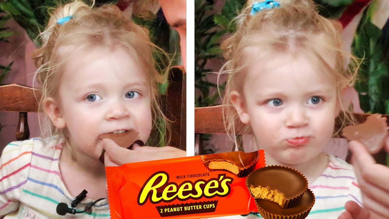 British 2-year-old tries Reese's Peanut Butter Cups for the first time!