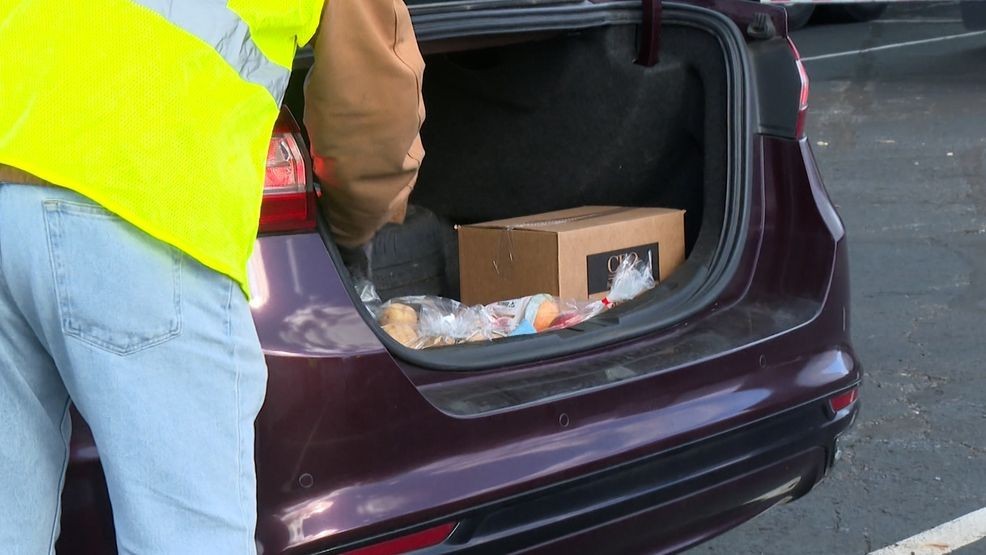 CEO Weinberg volunteers hand out ingredients for Thanksgiving meal ...