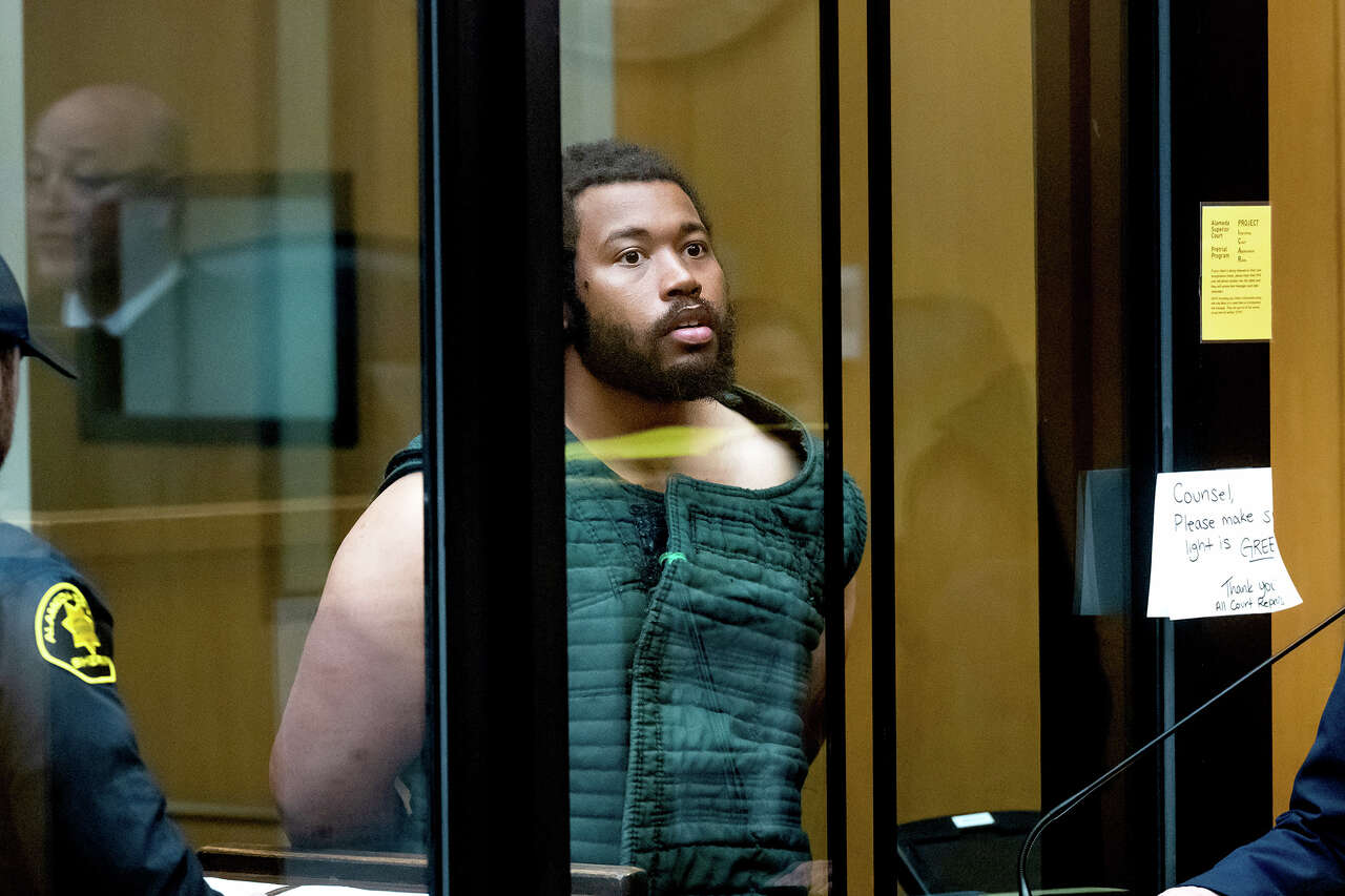 Man accused of killing coach John Beam appears in court handcuffed ...