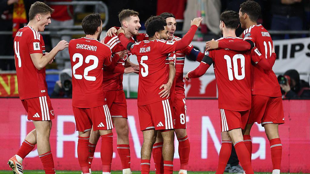 Two games from the World Cup - but who will Wales face?