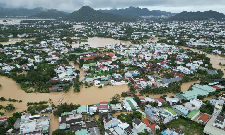 Floods, landslides leave 14 dead or missing in central Vietnam