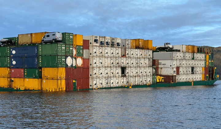 Loaded freight barge taking on water near Bella Bella