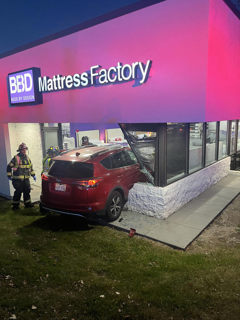 Car goes through store wall after crash in Centennial