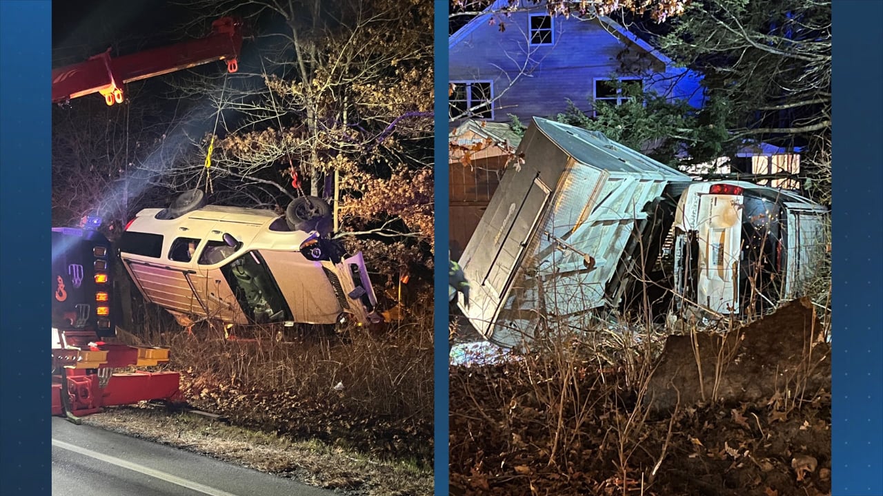 Car carrying trailer rolls over onto yard in Pelham, NH