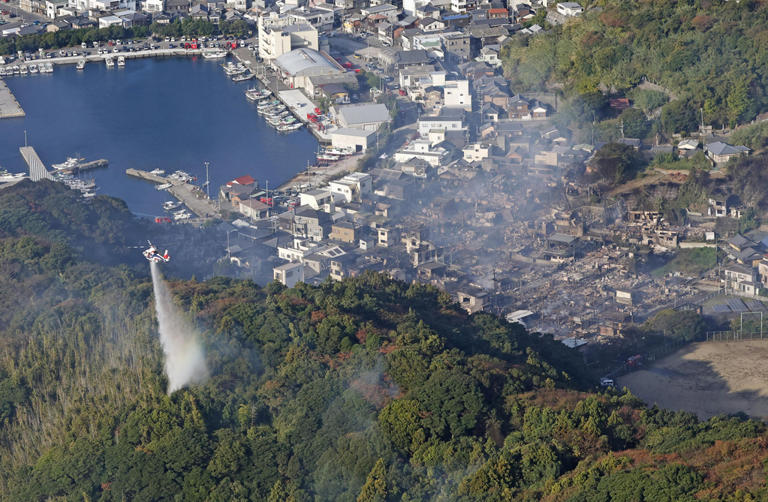 Fire burning in southwestern Japan damages 170 homes and forces evacuations