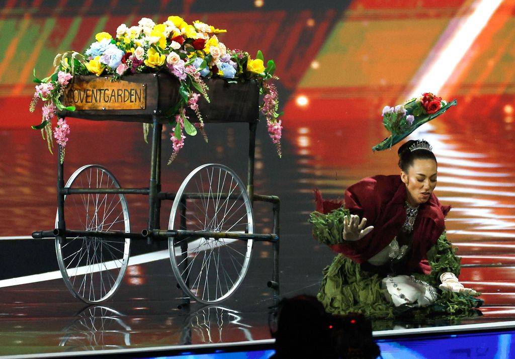 Miss Great Britain Danielle Latimer falls on stage as she competes in ...